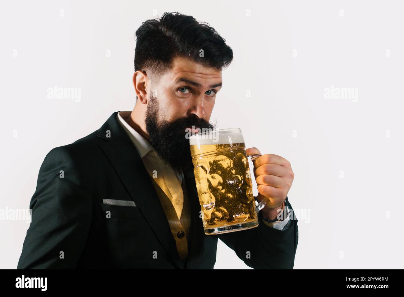 Portrait of handsome bearded man tasting a craft beer. Stylish handsome ...