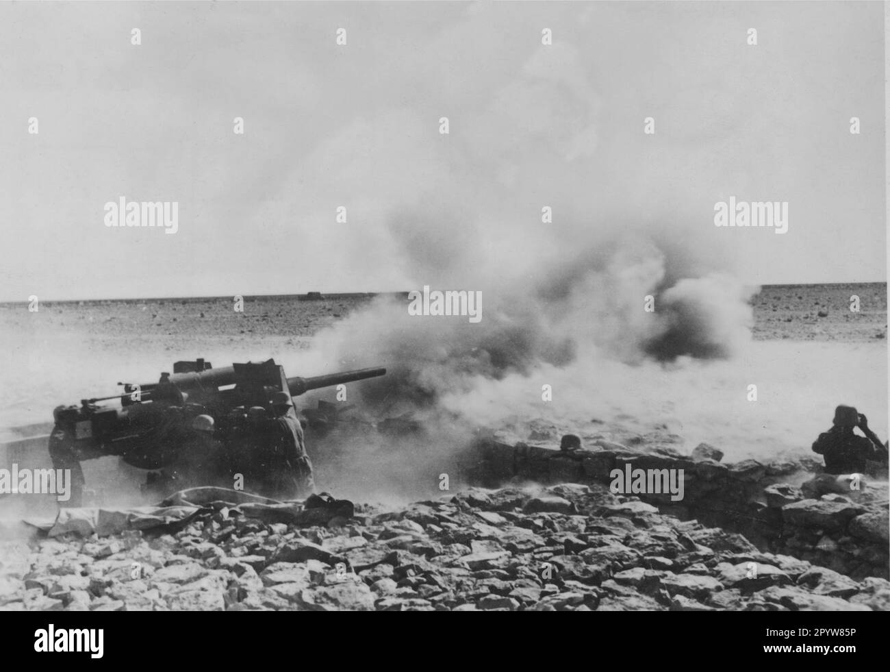 88mm gun of the Afrika Korps firing at ground targets on the front near ...