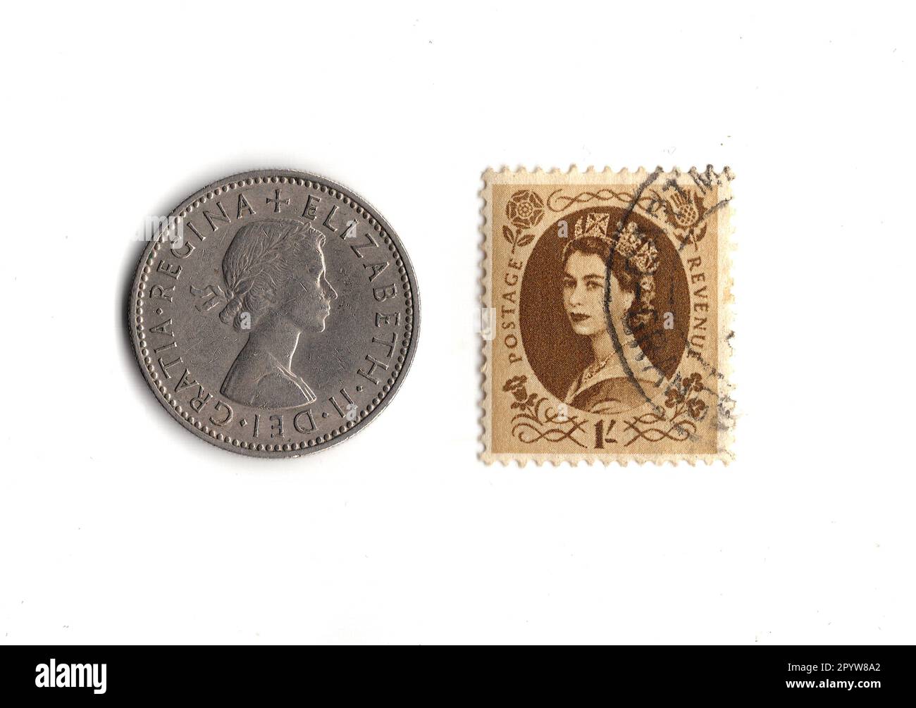 One shilling coin and stamp from the reign of Queen Elizabeth II ...