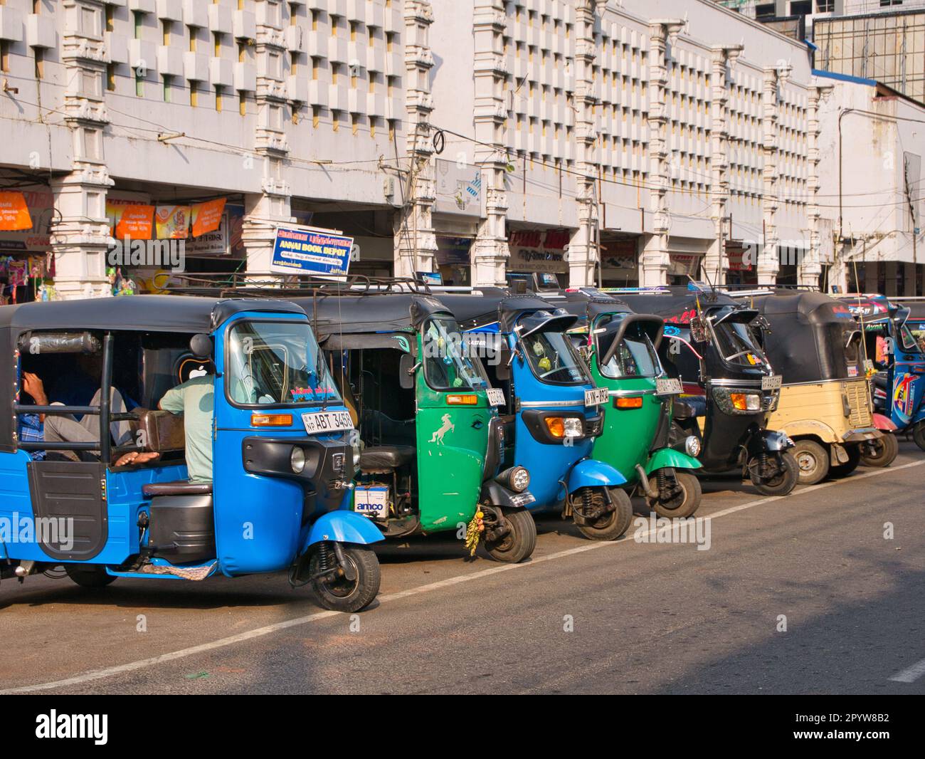 A row of tuc tucs parked in the central reservation of Hospital Road in ...