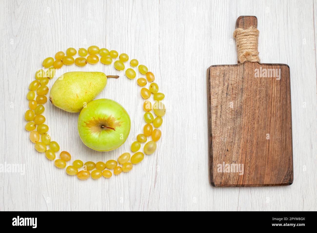 top view fresh green grapes with pear and apple on the white desk fruit ...