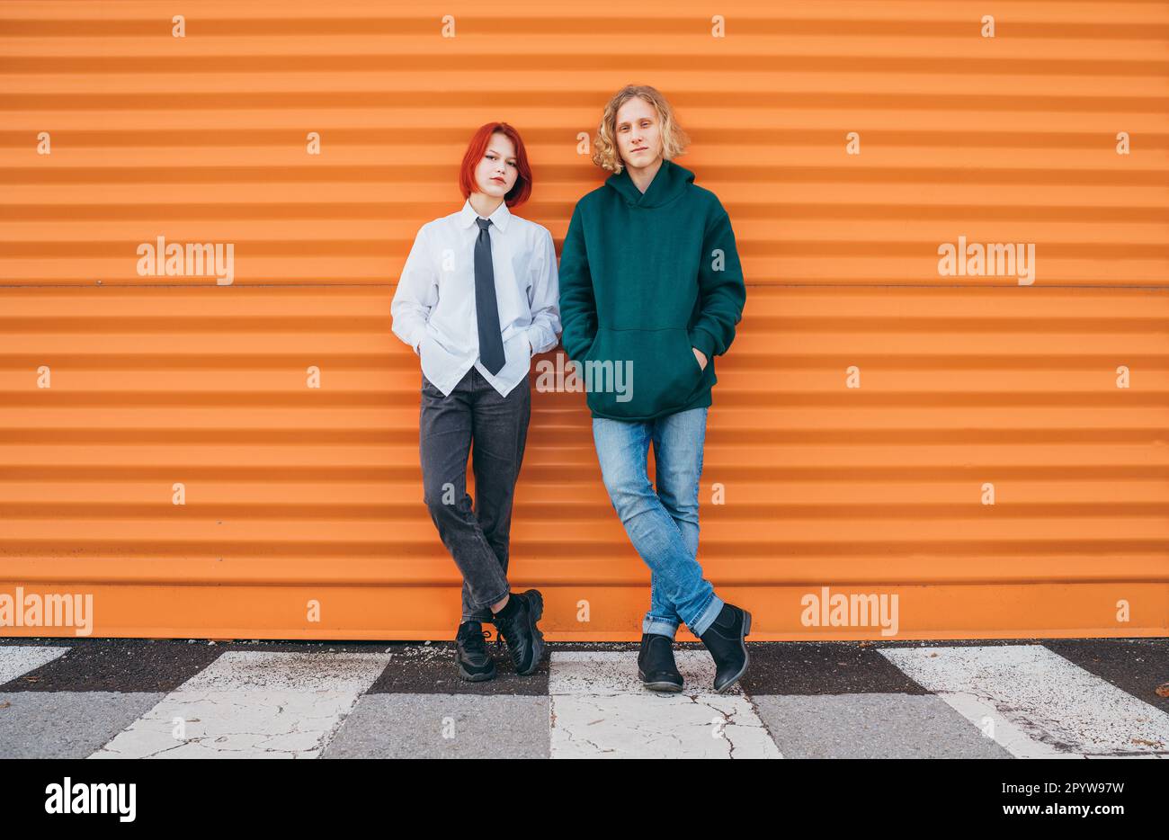 Portraits of two caucasian teen friends boy and girl posing for photo ...
