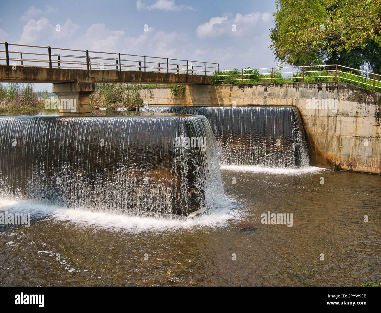 Water cascades over water level control weirs - part of the tank ...