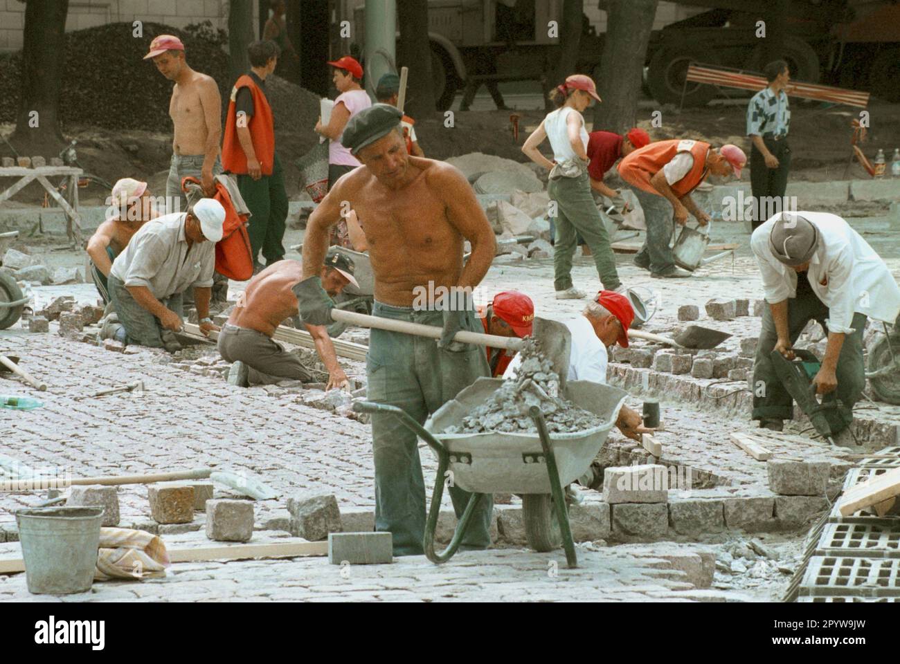 Ukraine / Shitomir / 1998 Construction workers repave St. Sophia Square ...