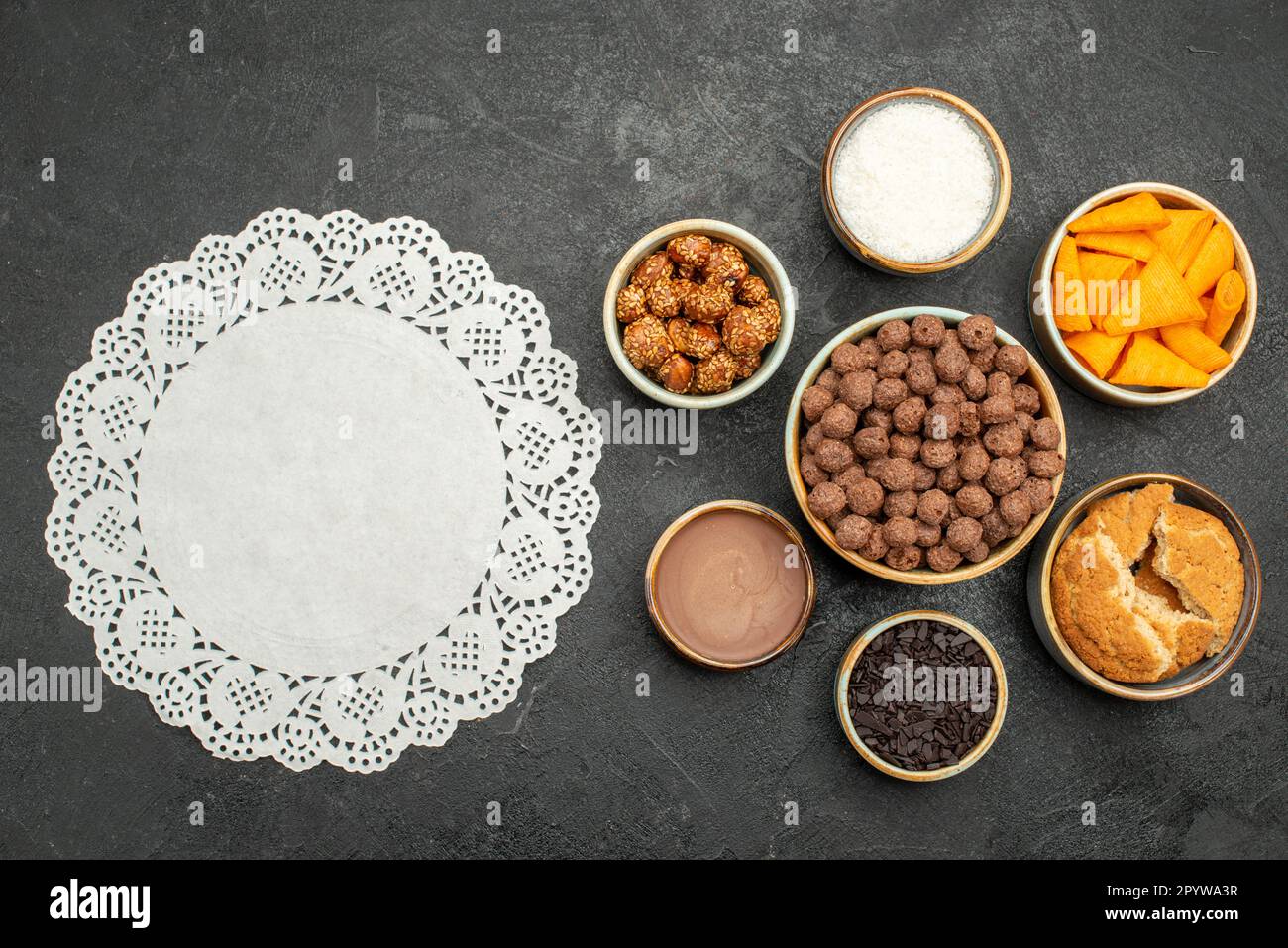 top view sweet nuts with cocoa flakes and cips on dark background snack ...