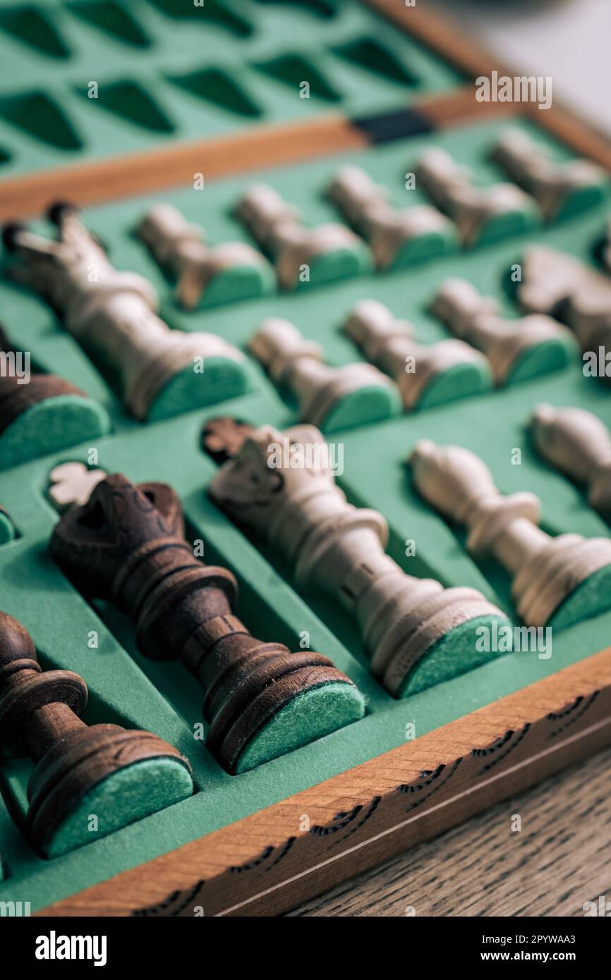 A collection of chess pieces arranged in a wooden case Stock Photo - Alamy