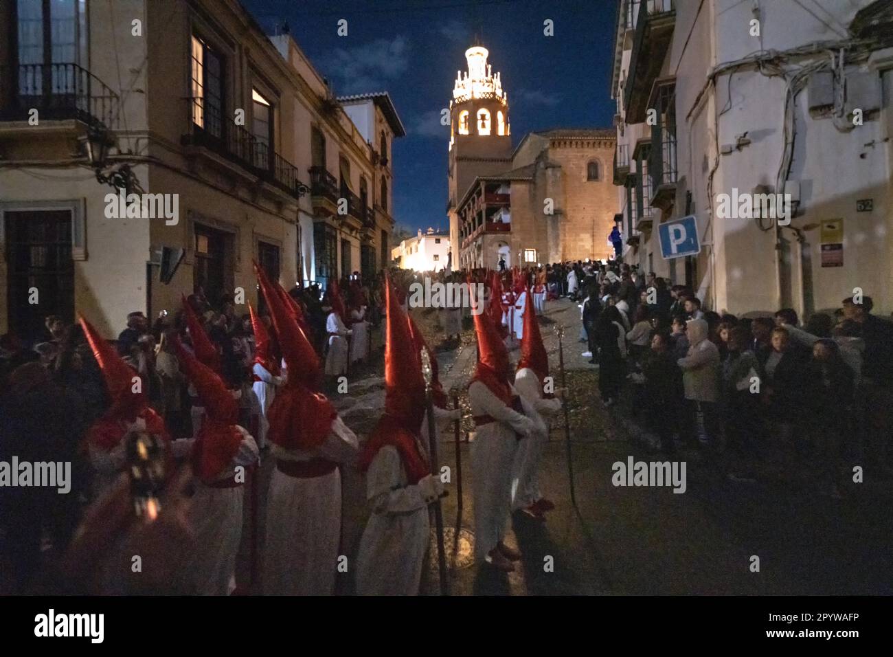 Cofradias wearing red cone shaped hoods during the midnight silent ...