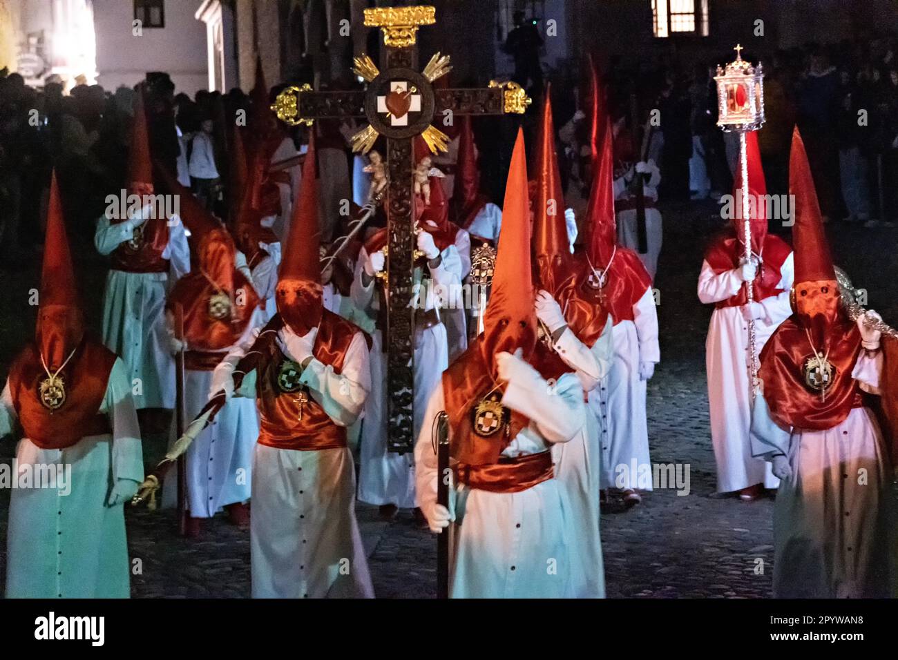 Cofradias wearing red cone shaped hoods during the midnight silent ...