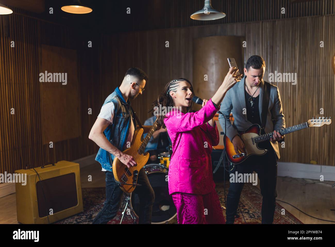 Rock band rehearsal in the studio. High quality photo Stock Photo - Alamy