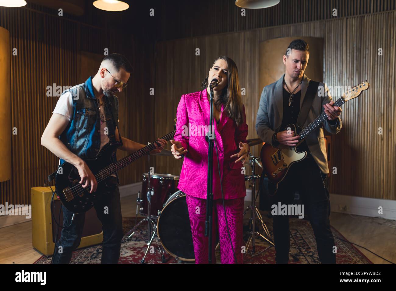 Rock band rehearsal in the studio. High quality photo Stock Photo - Alamy