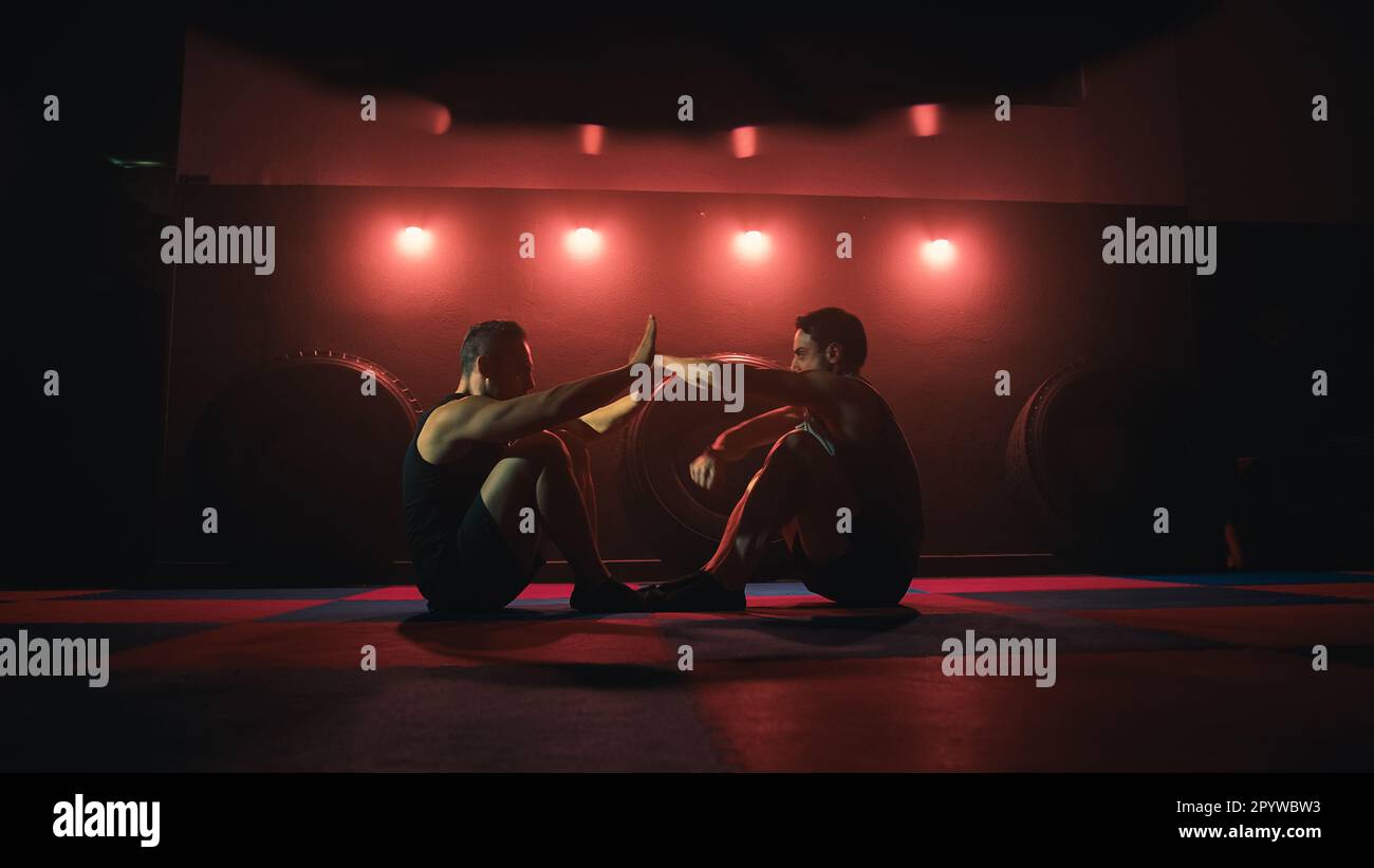 Athletes doing Crunches together Stock Photo - Alamy