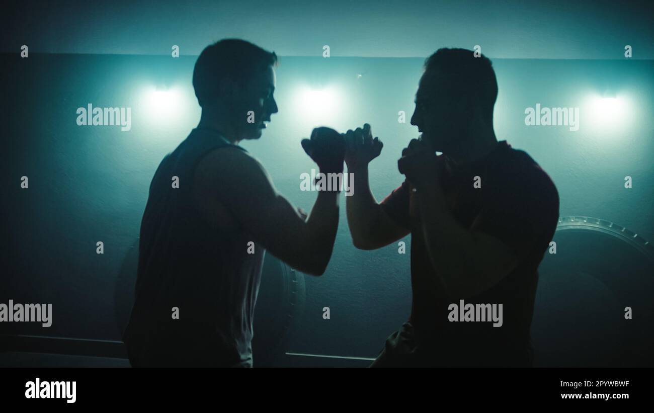 Fighters training silhouette in gym hi-res stock photography and images ...