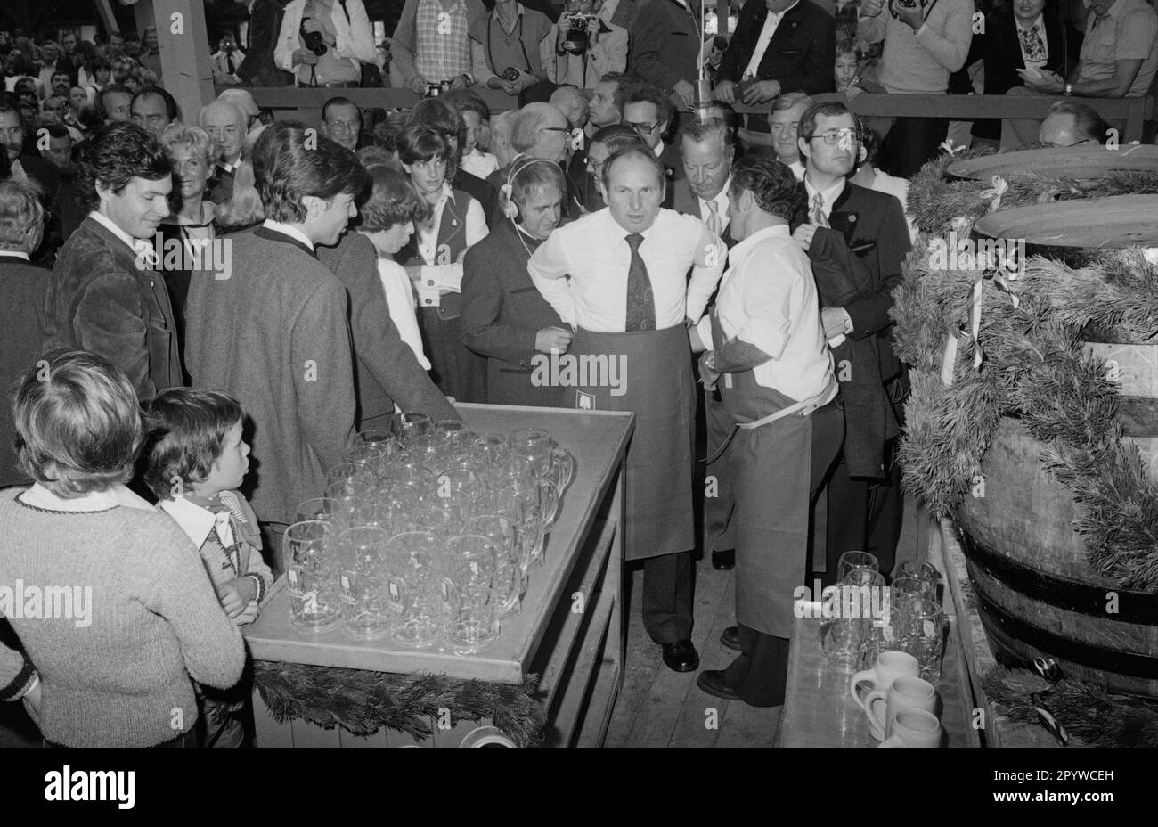 Munich's Lord Mayor Erich Kiesel at the tapping. To the left of Kiesel ...