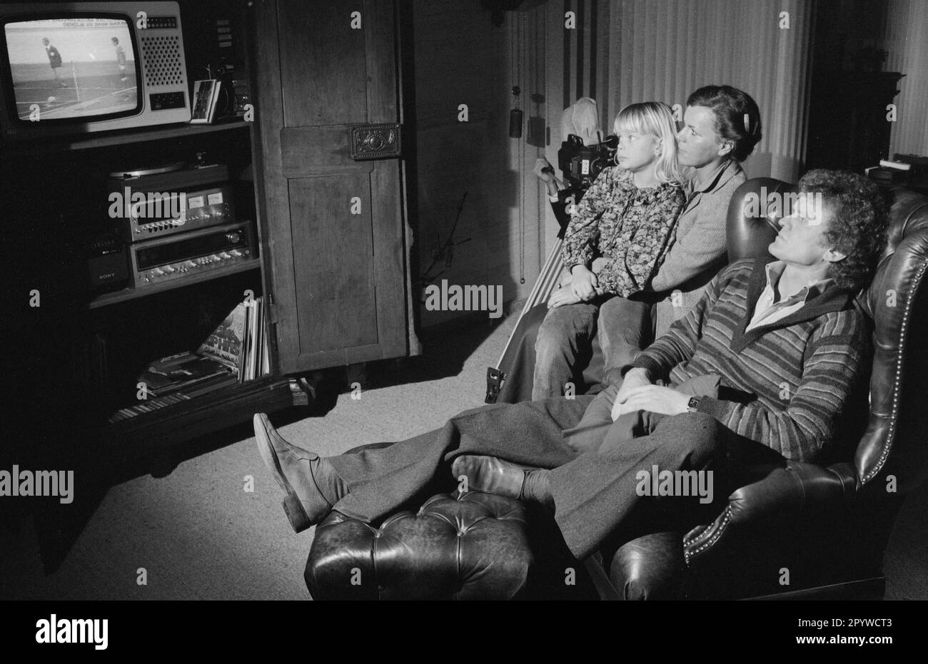 Sepp Maier with wife and daughter watching television. [automated ...