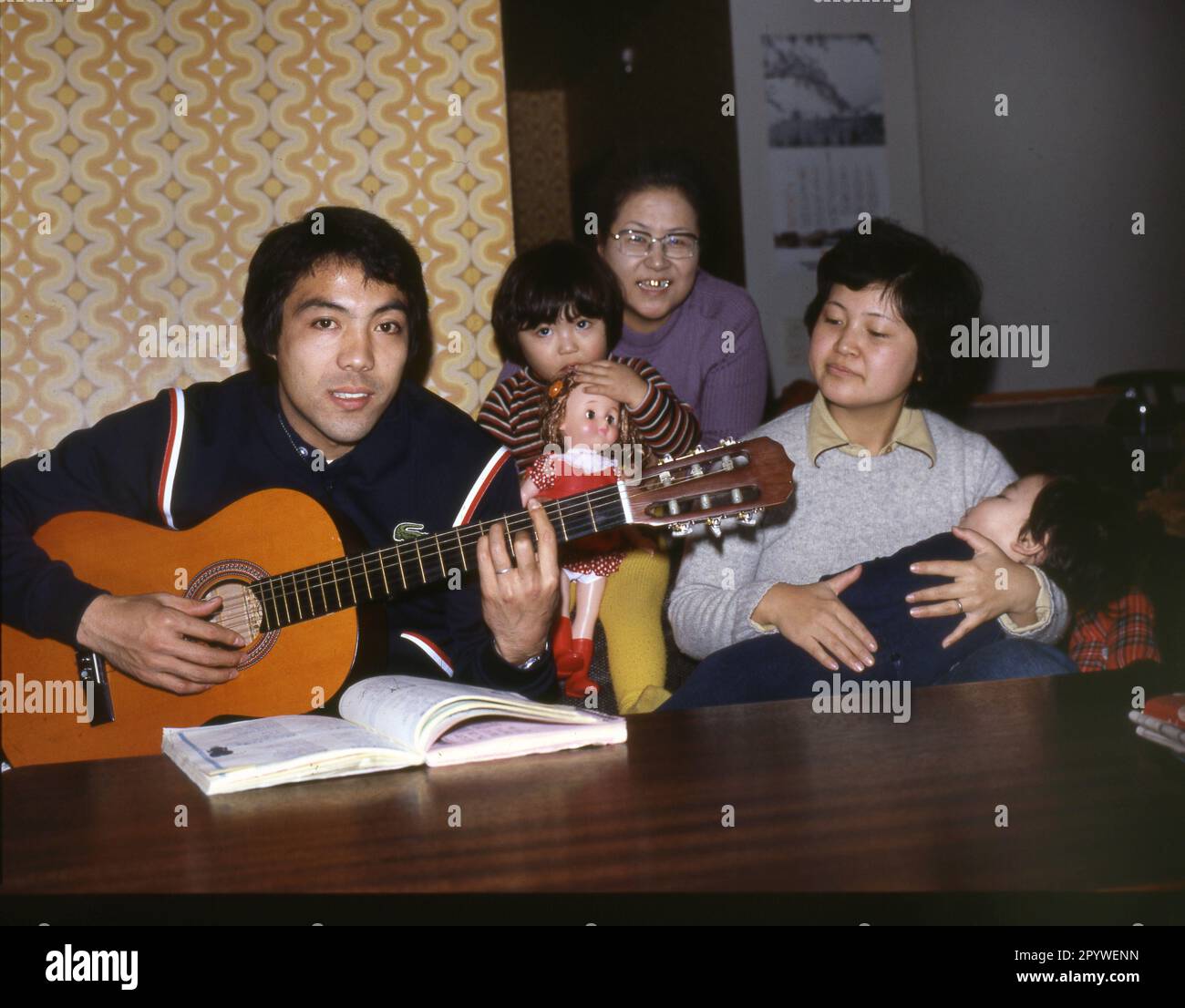 Yasuhiko Okudera (1. FC Koeln) with family f.l. Yasuhiko, with guitar ...