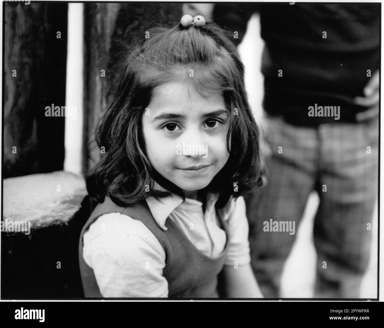 West Berlin. Child portrait. Girl looks at the camera. Black-and-white ...