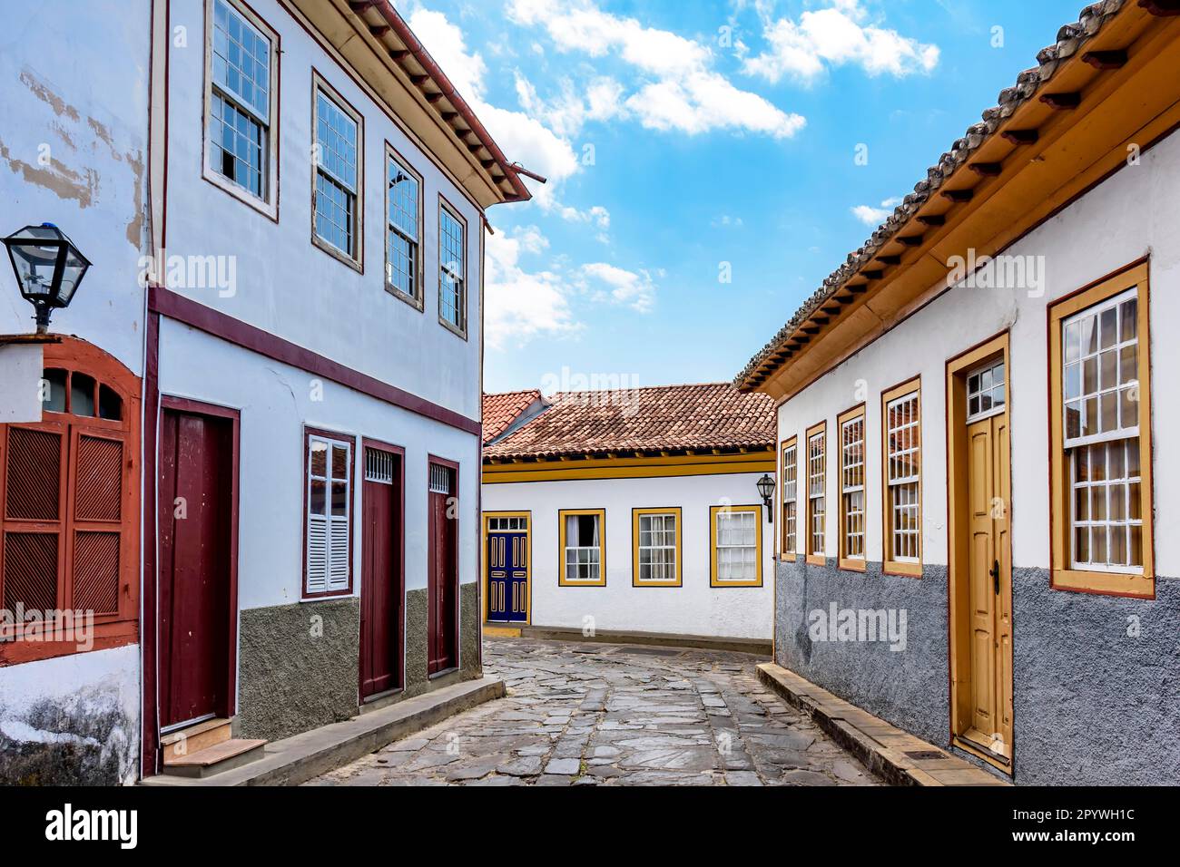 Street with cobblestones and houses with colonial architecture in the ...