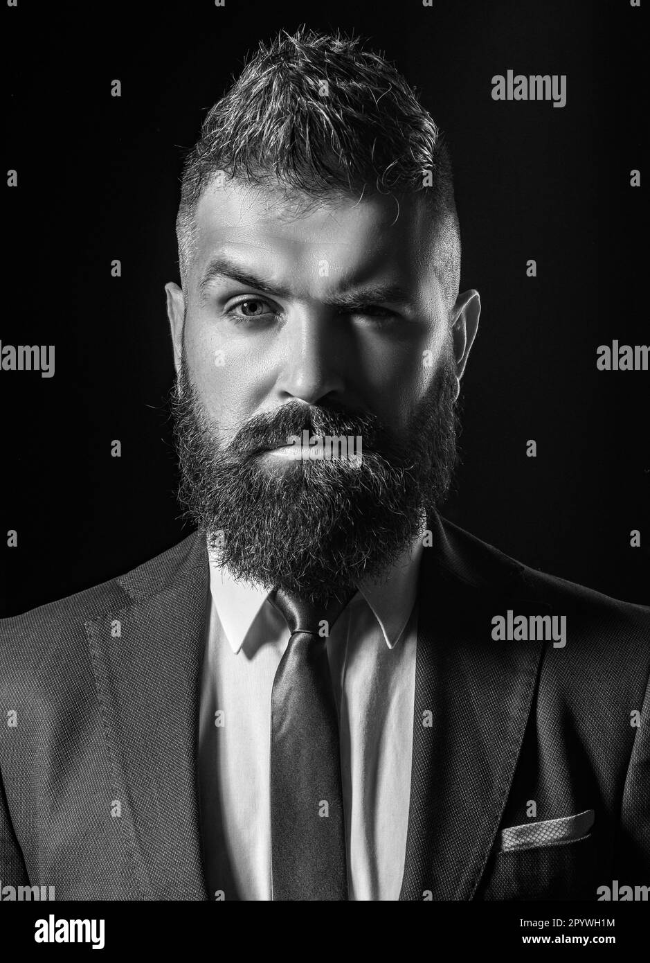 Businessman In Dark Grey Suit On Black Background Isolated Man In