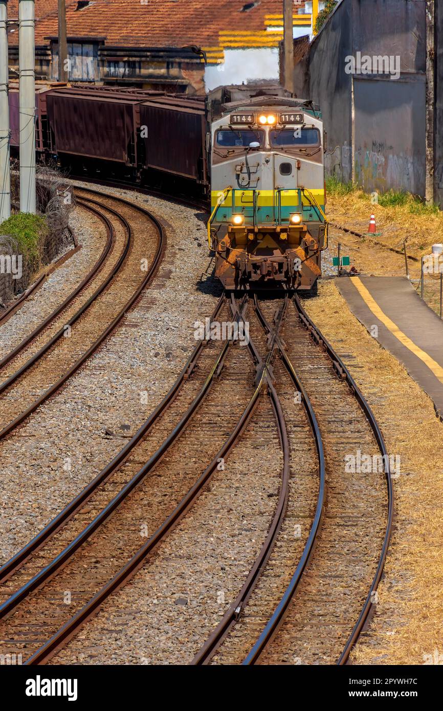 Old freight train worn out by time and use arriving in the city of Belo ...
