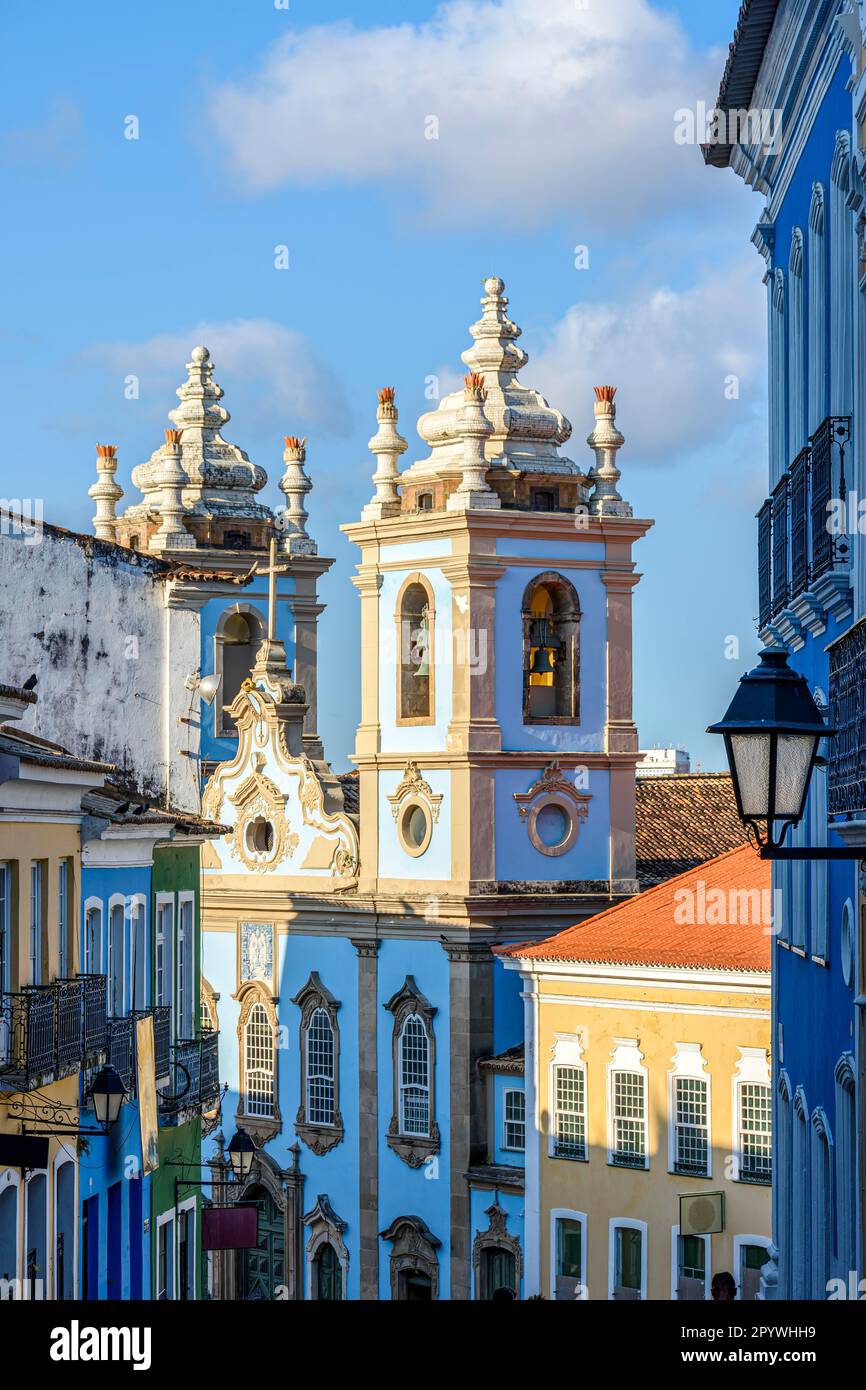 Old facades of colorful colonial-style houses, lanterns and windows and ...