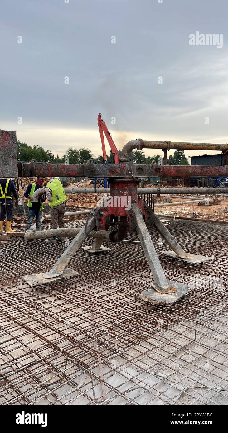 The male construction workers hard at work on a construction site Stock ...