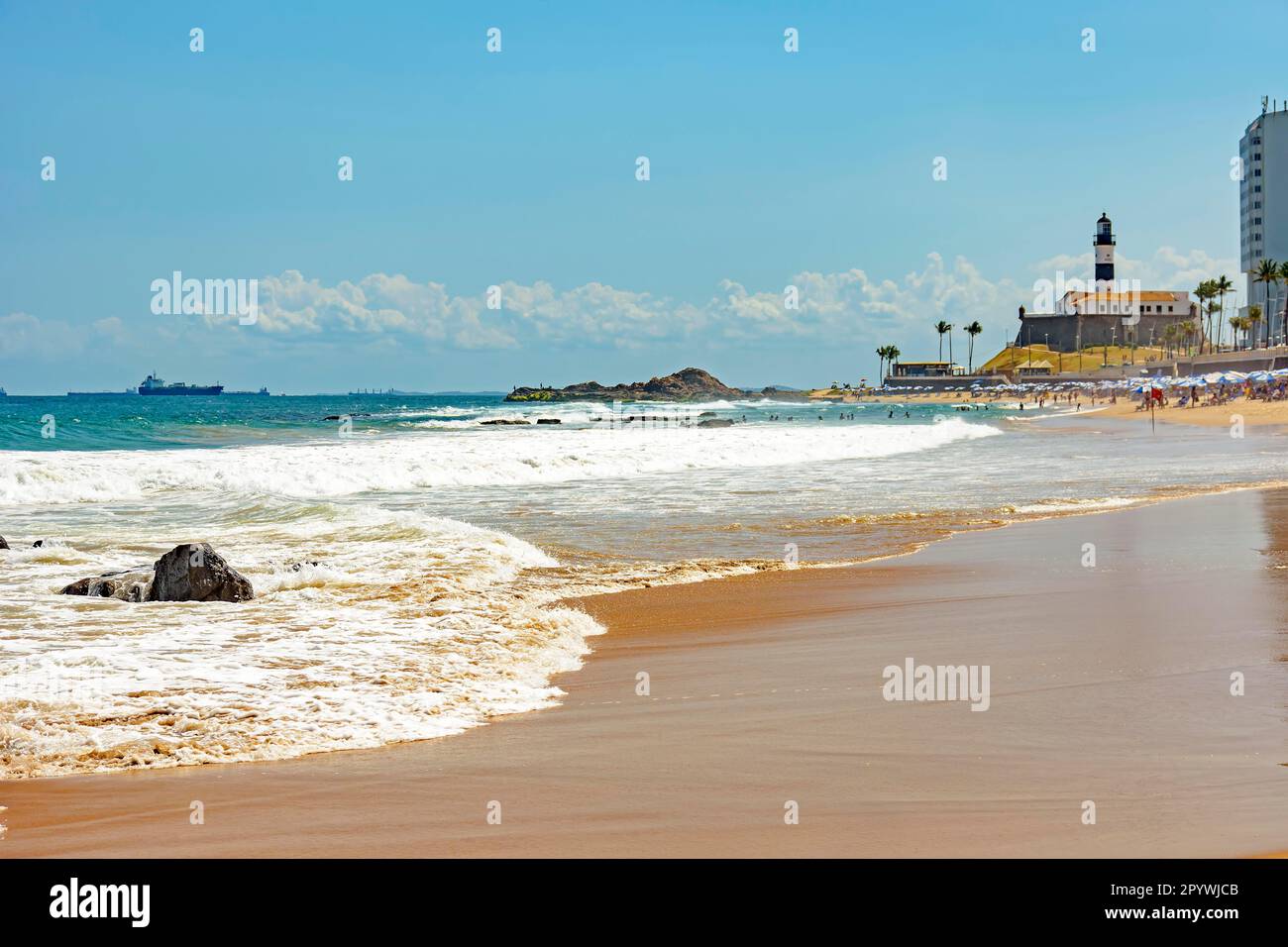 Barra beach buildings and lighthouse seen from afar with the summer sun ...