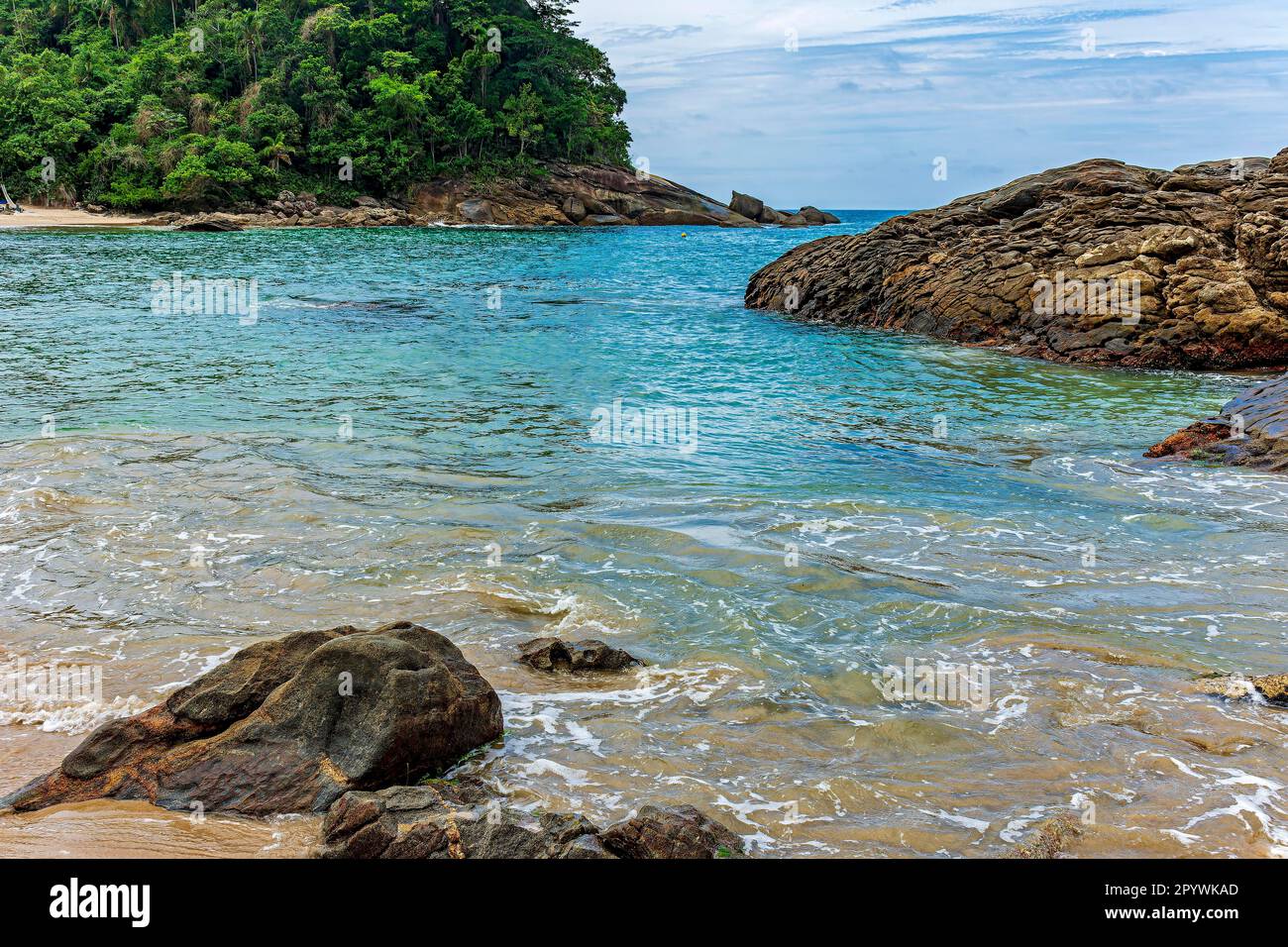 Beach surrounded by rainforest of the tropical paradise of Trindade in ...