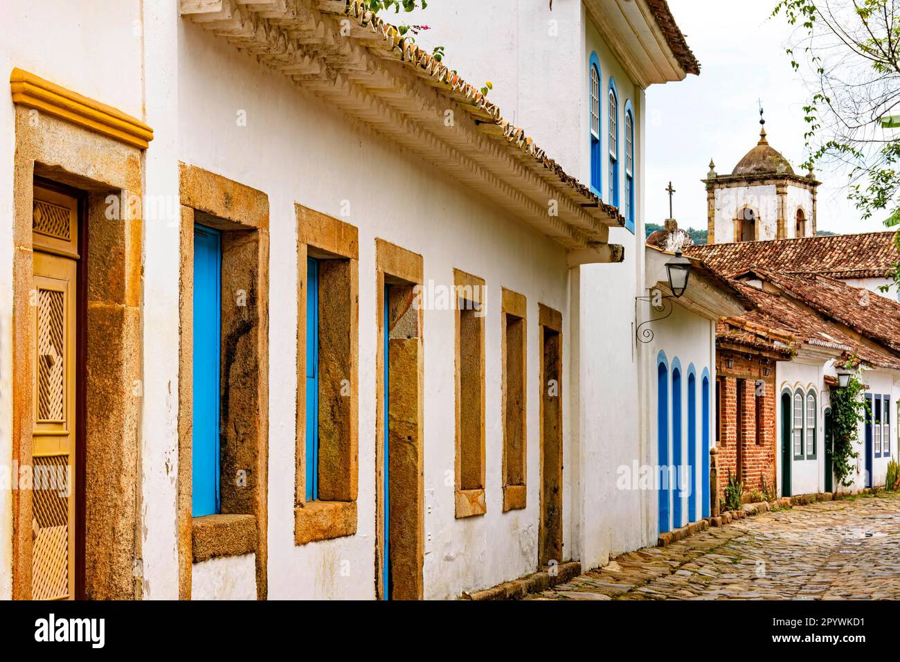 Old houses facades in colonial architecture and cobblestone streets in ...