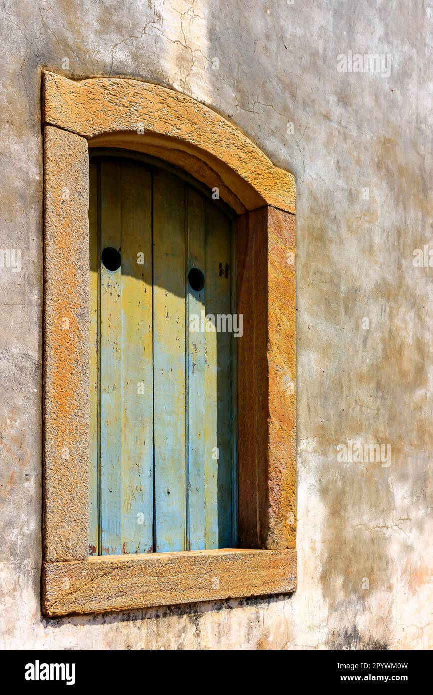 Historic church window in colonial style with stone frame in the ...
