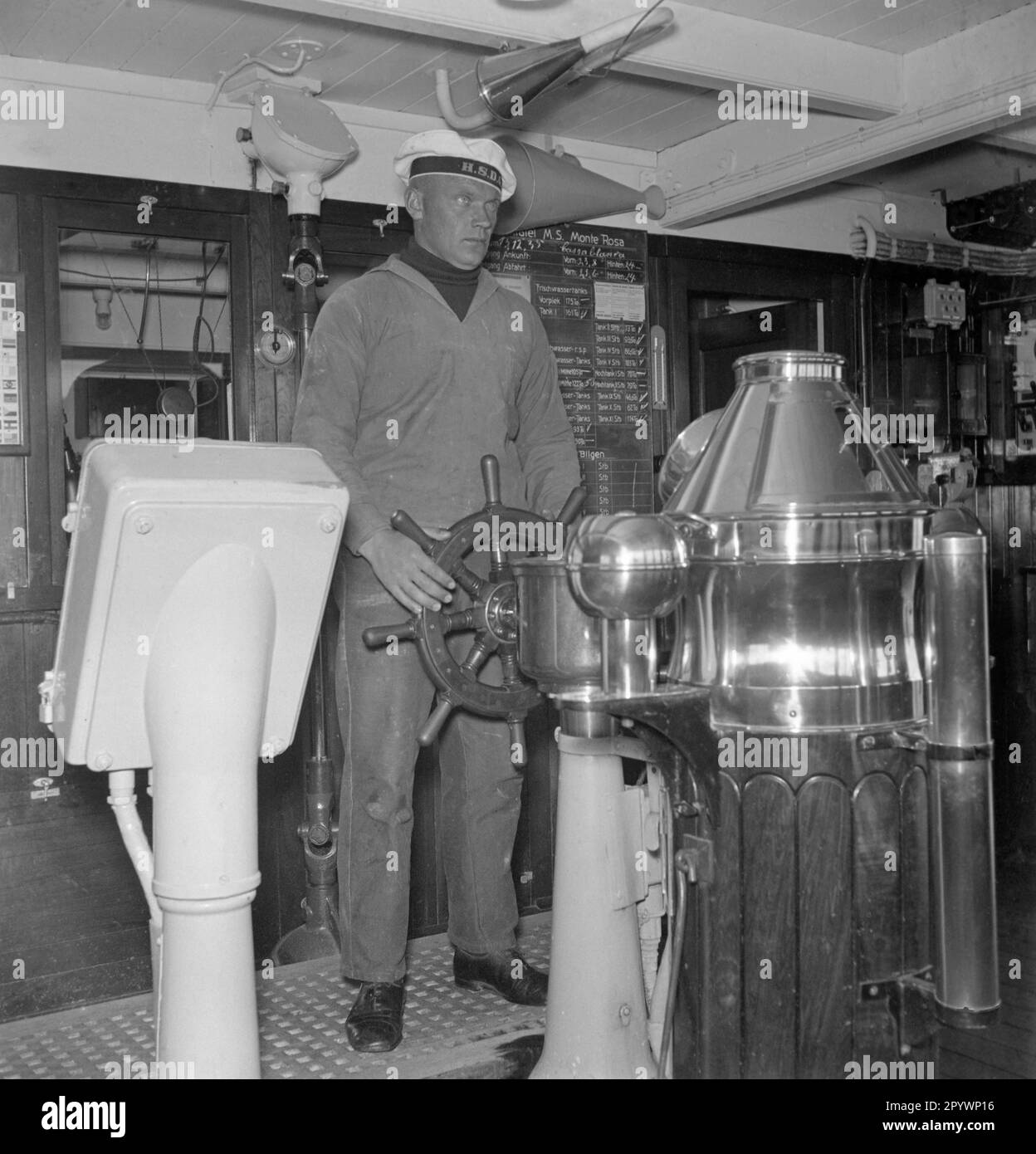 "A helmsman on the bridge of the ""Monte Rosa"" of Hamburg Sued in the ...