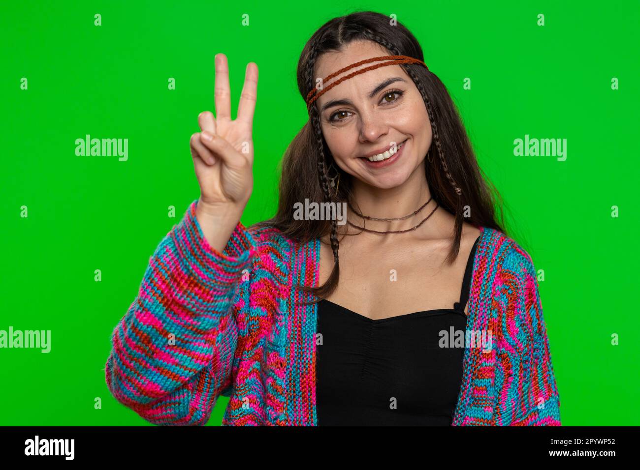 Young woman showing victory sign, hoping for success and win, doing ...