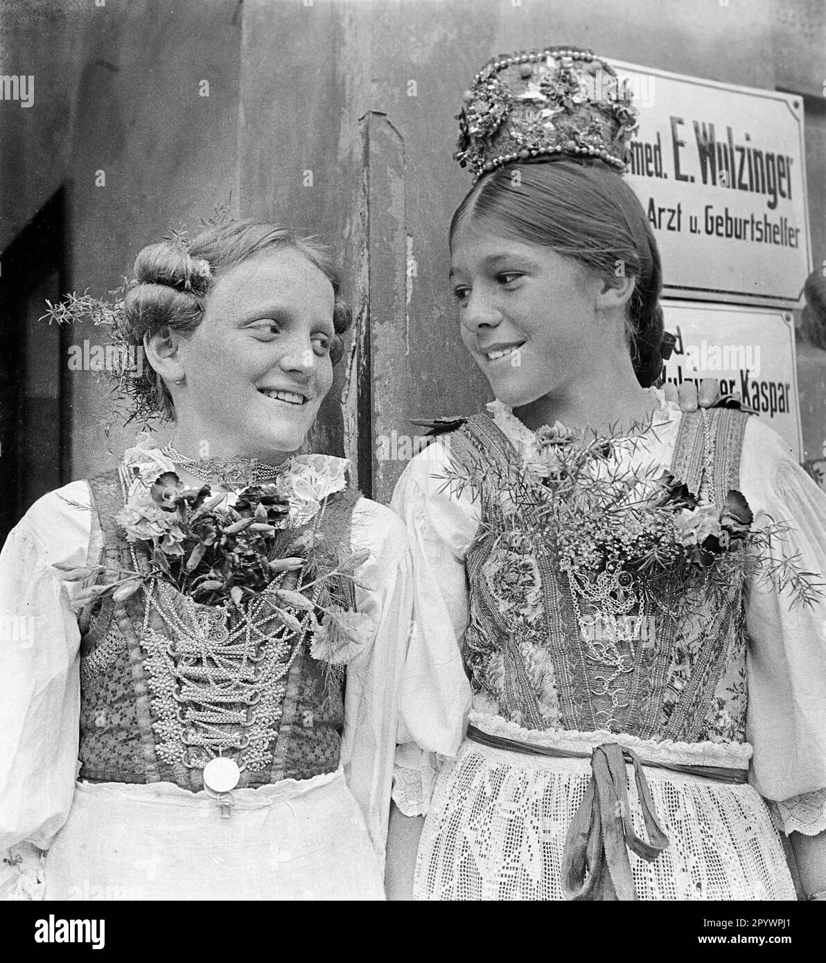 Two girls are wearing traditional costumes from Berchtesgaden. Undated ...