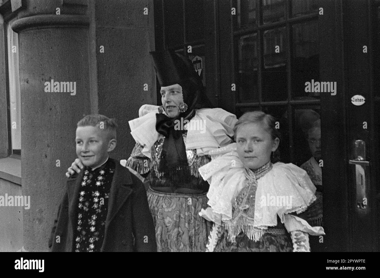 A woman with two children in costume. Presumably in Berlin, 1935 Stock ...