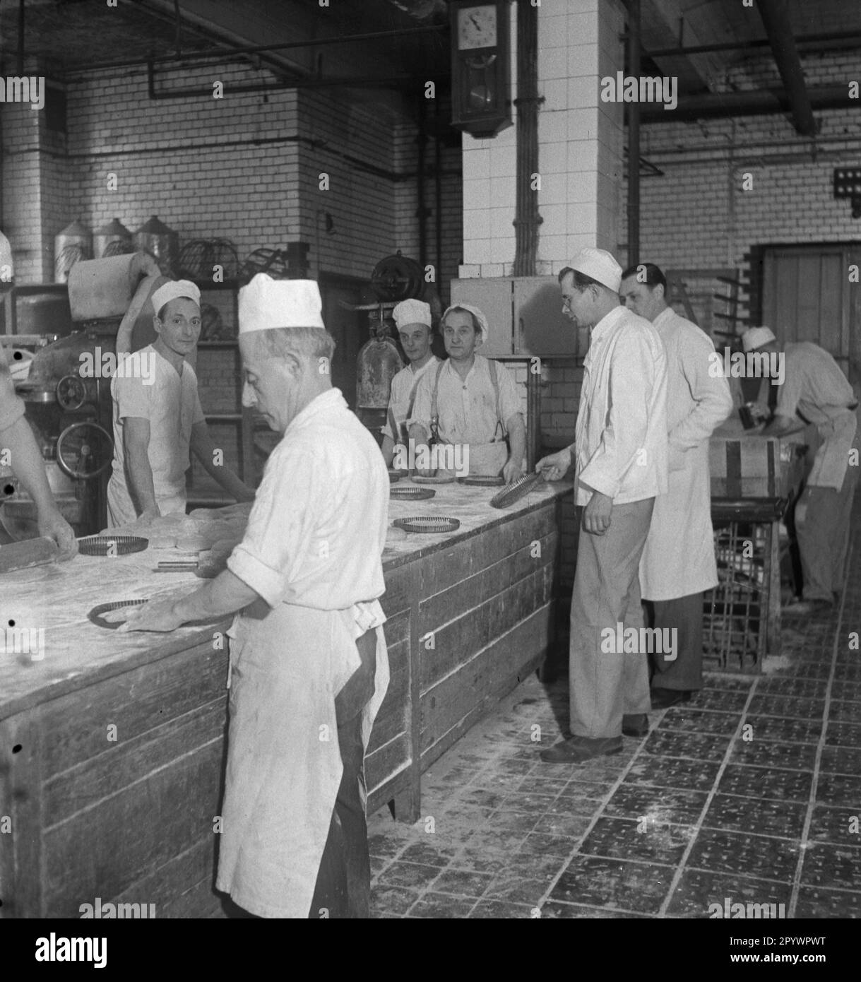 Worker in a bakery of the industrial bakery Wittler Brot. After the ...