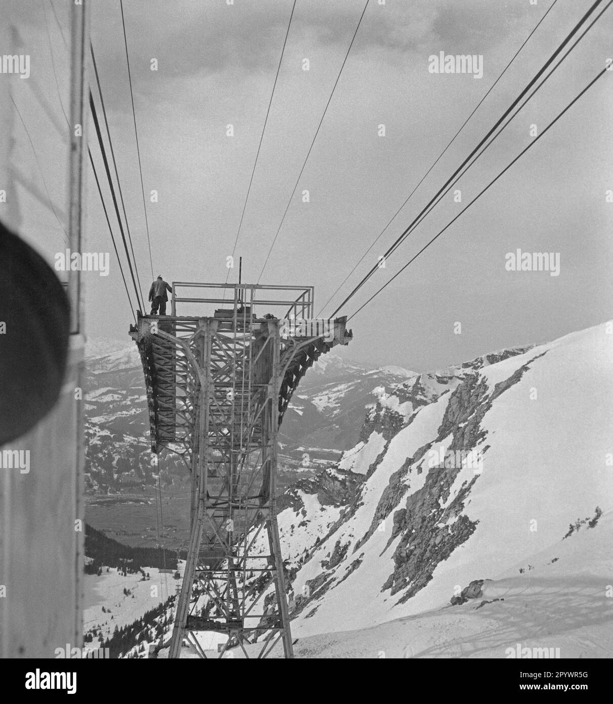 View into the valley from a cabin of the Nebelhorn cable car. On the ...