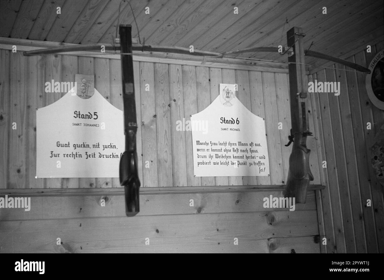 At a shooting range in St. Johann, crossbows hang from the ceiling ...