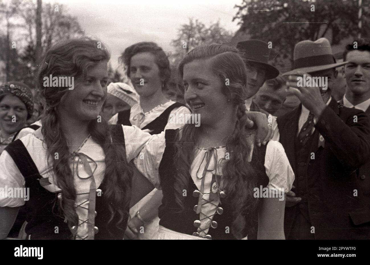 Two young women in traditional costume at a traditional costume ...