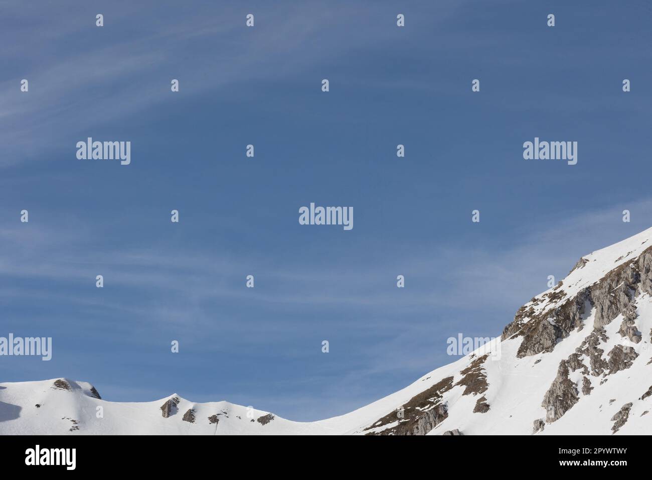 Snow-capped peaks under the clear blue sky at Monte Terminillo Stock ...