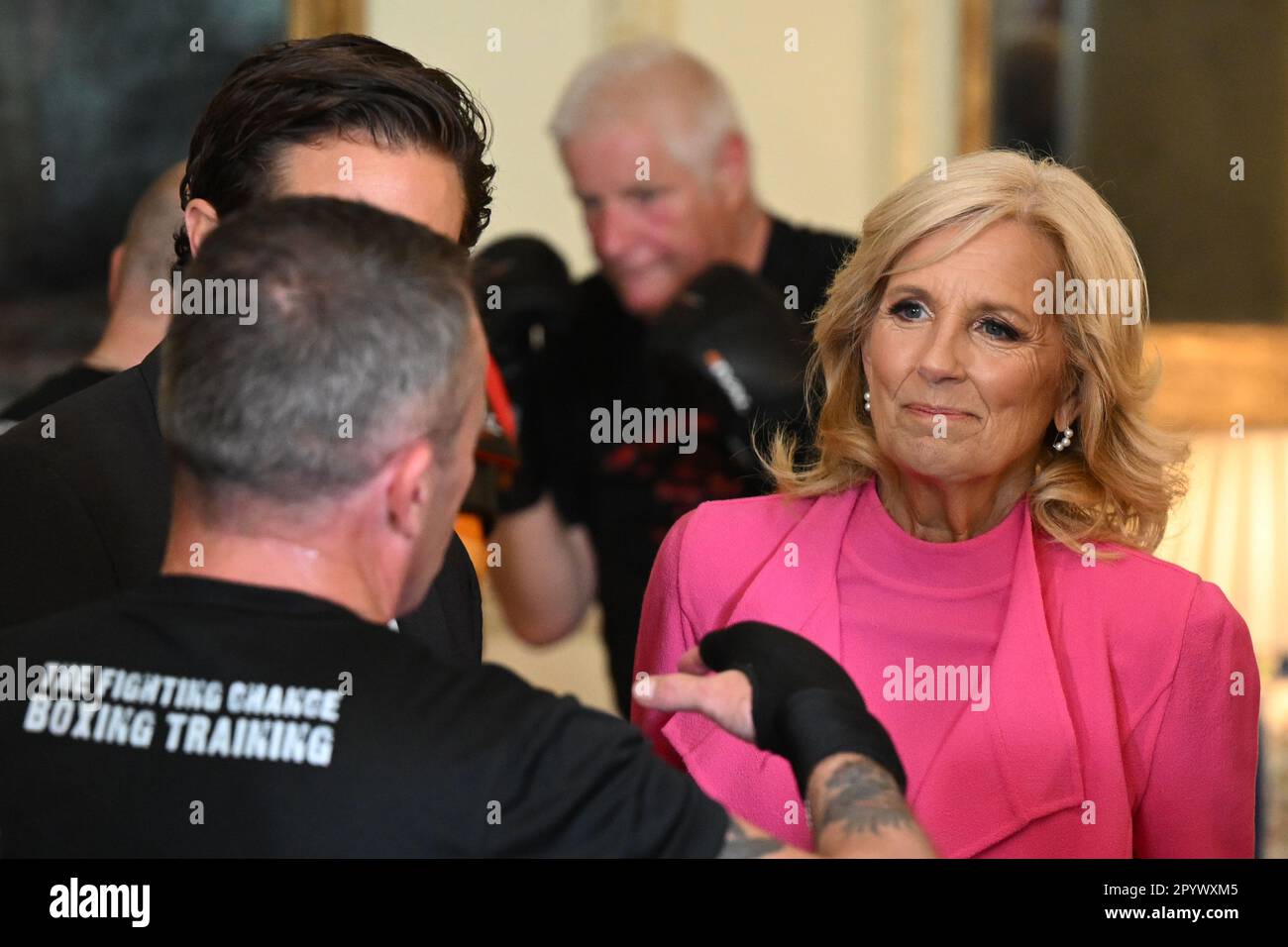 First Lady of the United States, Dr Jill Biden speaks with members of a ...