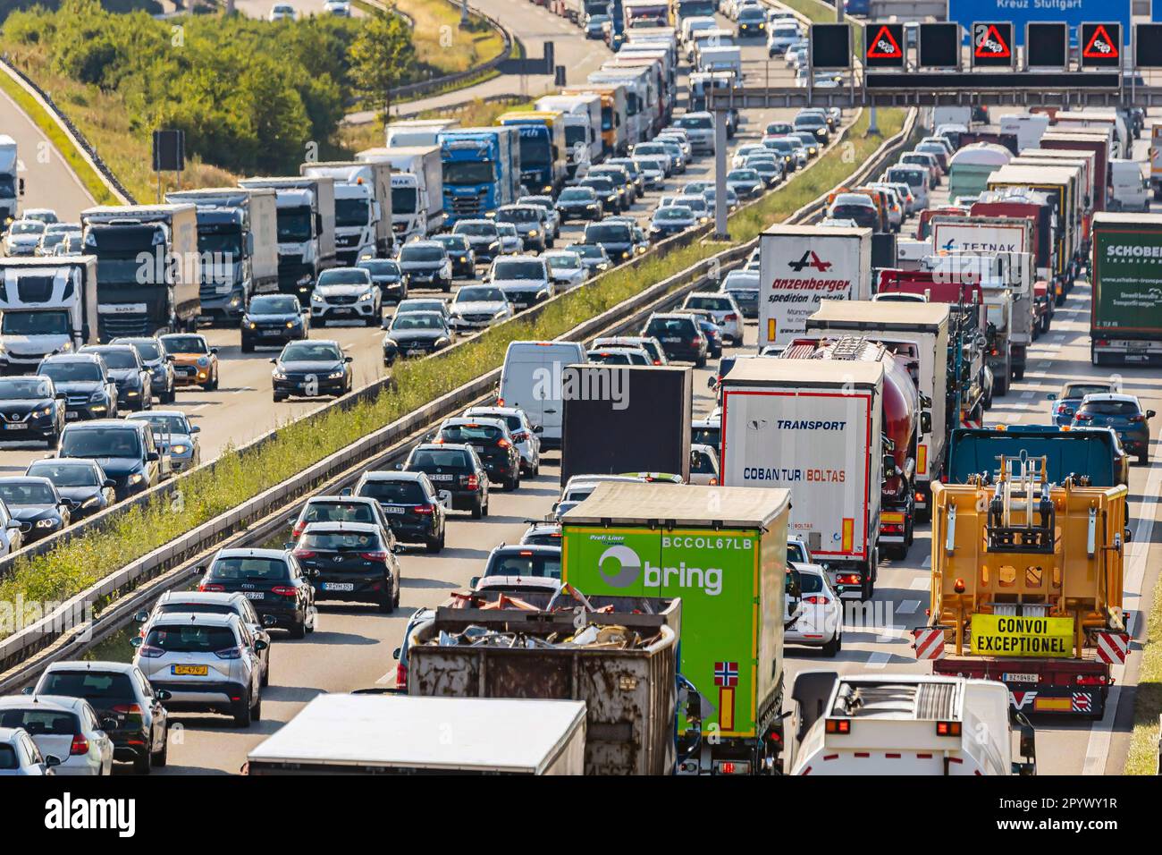 Heavy traffic with congestion, trucks and cars on the A8 motorway near ...