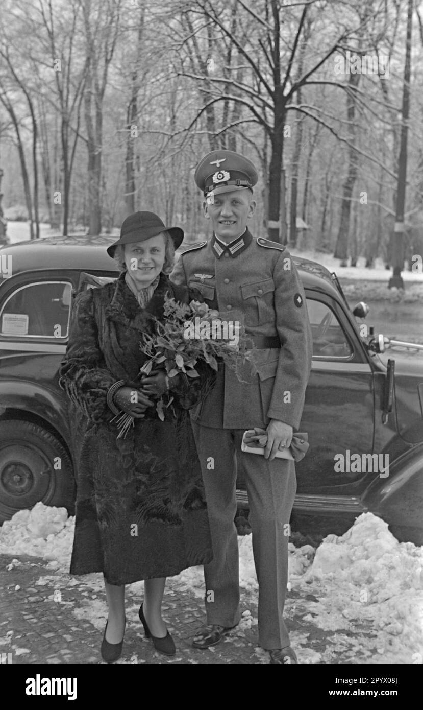 A German soldier with his wife. The soldier wears a dress uniform of an ...