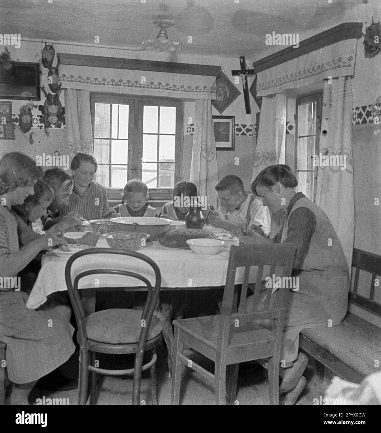 "Family on a farm in Upper Bavaria while eating. From the series ...