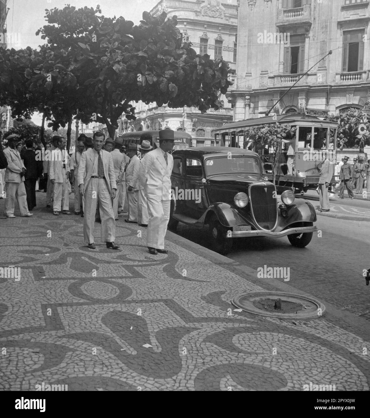 Street scene in Rio. On the right side of the street are magnificent ...