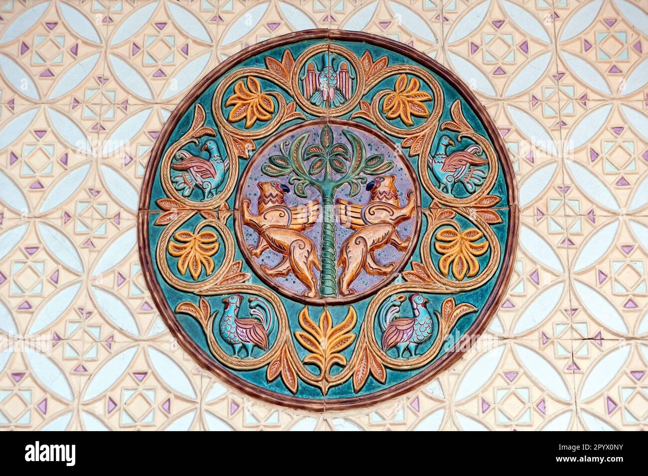 Circular glazed ethnic decoration on wall of Archangelo-Mikhailovsky ...