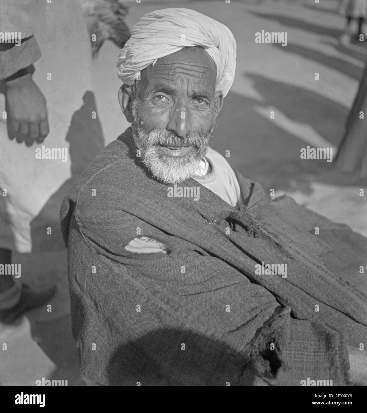 An elderly, seated man in Rabat Stock Photo - Alamy