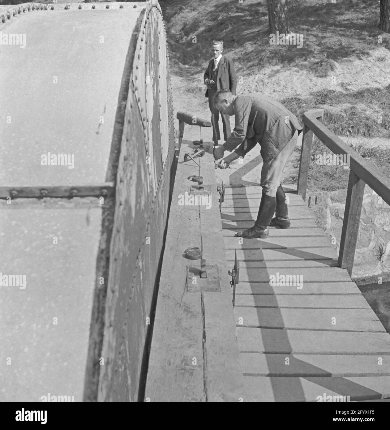 A worker demonstrates the functioning of the eel trap Stock Photo - Alamy
