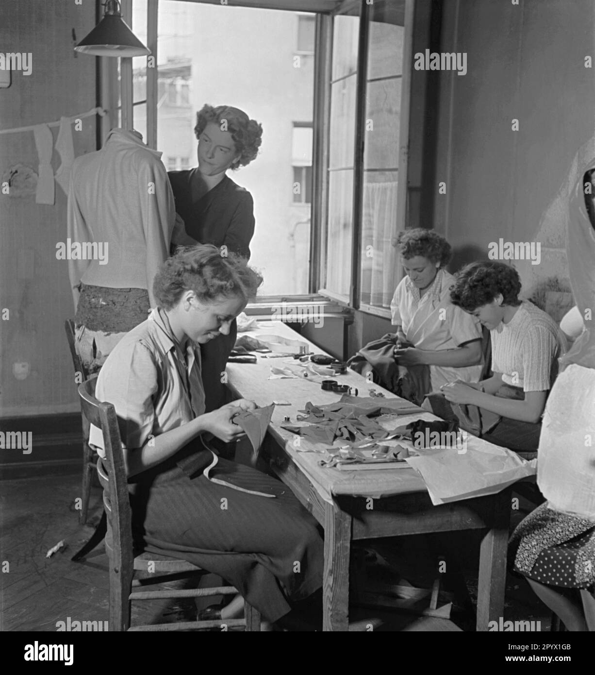Women working on motifs and patterns for clothes Stock Photo - Alamy