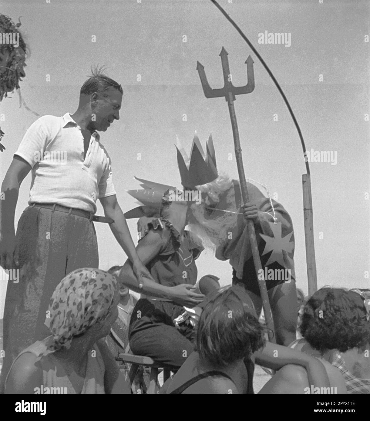 People at a beauty contest during a beach party in Warnemuende. In the ...