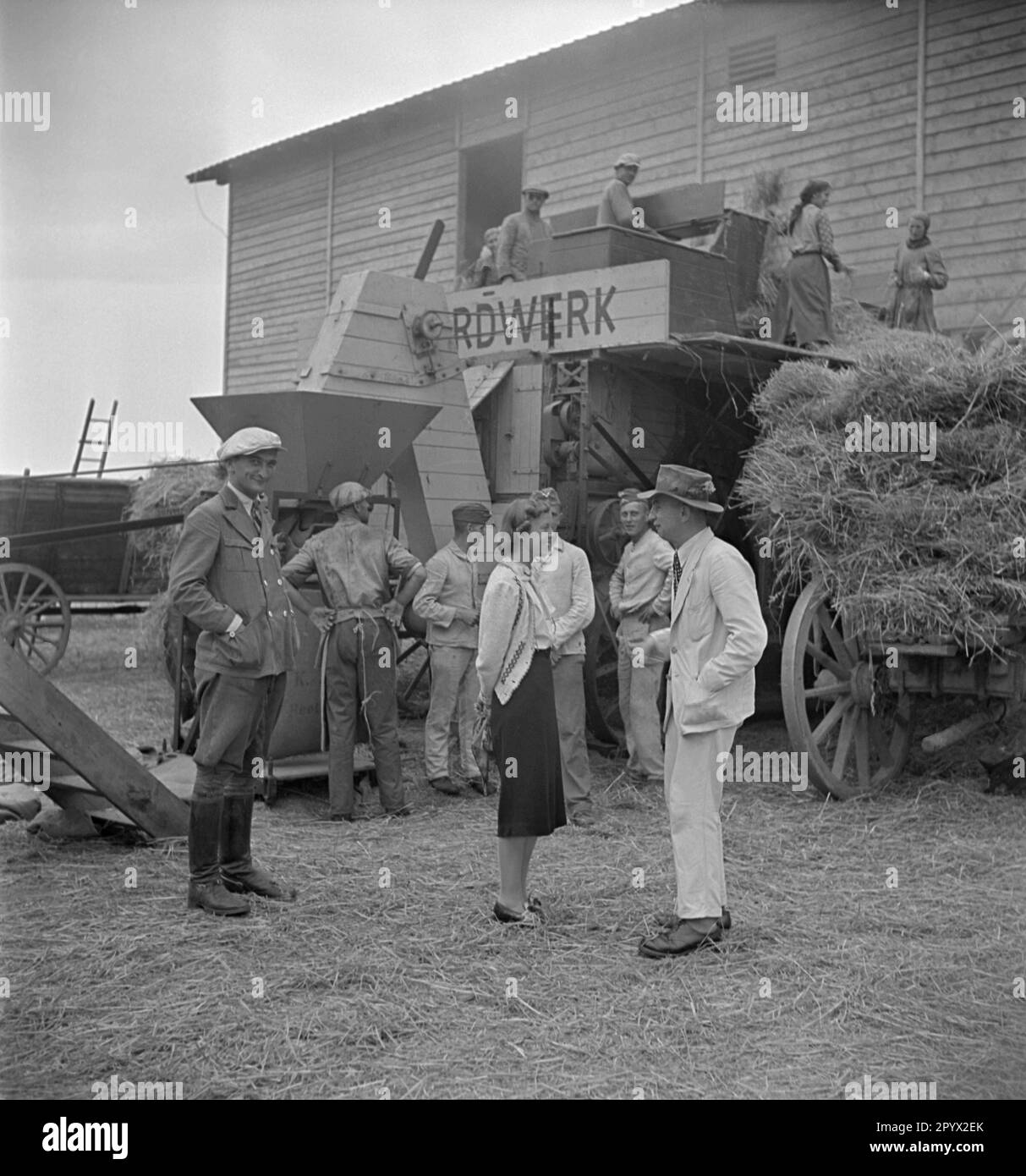 Threshing of grains on the estate Ziegenhagen in the province of ...