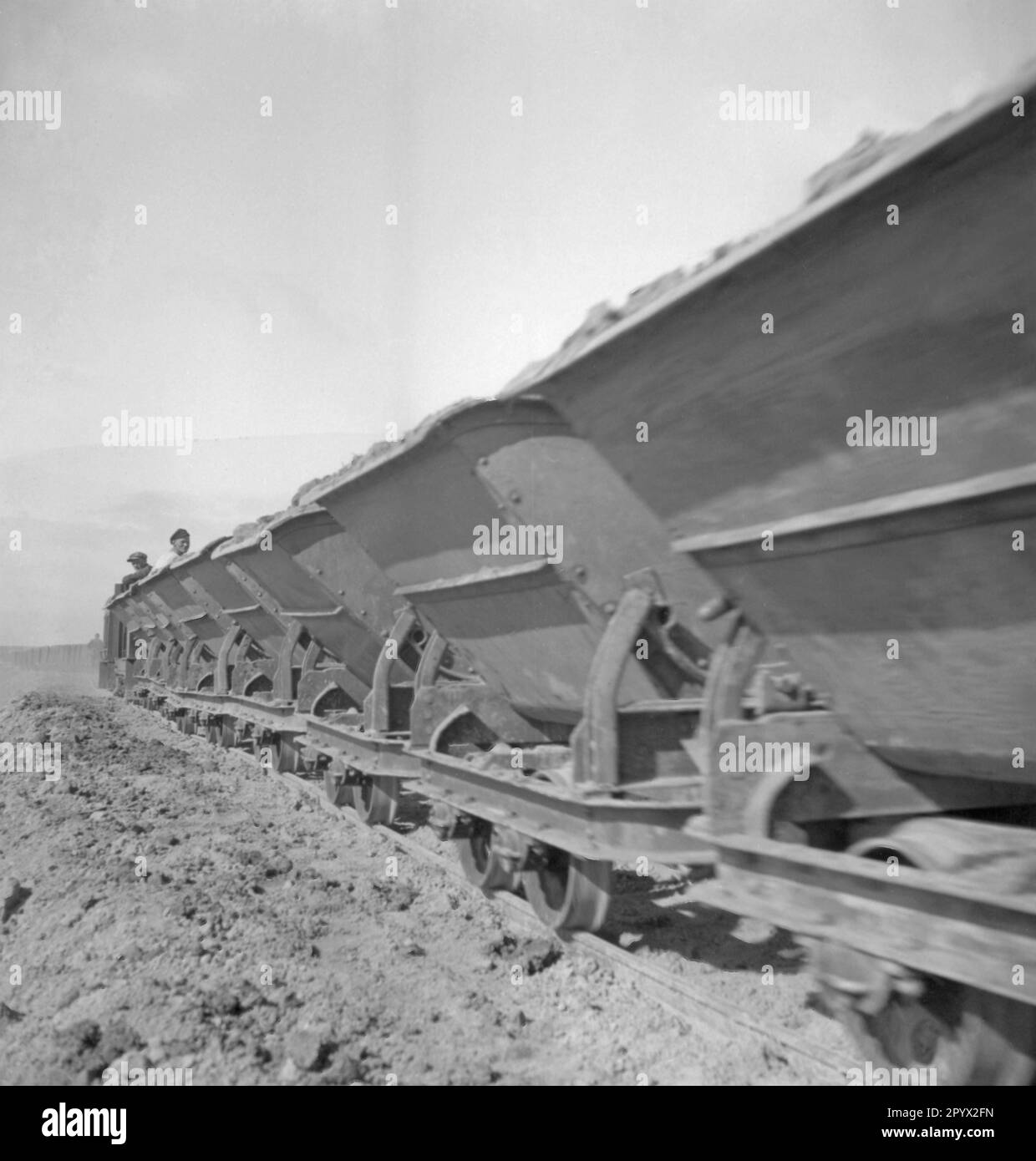 A loaded trolley train runs on layable tracks through the Koog. Undated ...